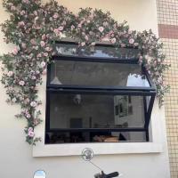 China Aluminum Alloy Vertical Fold Window Thermal Insulation Double Glass Windproof Soundproof Bifold Window for Hotel Outdoor Use for sale