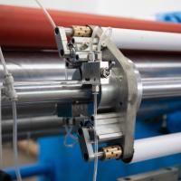 China Food Packaging Semi Automatic Double Station Cling Film Baking Paper Aluminum Foil Roll Rewinding Machine for sale
