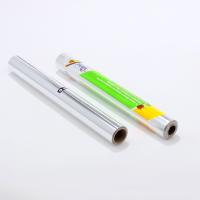 China Kitchen Customized Width Aluminum Foil Roll with Plastic Film and Lubricated Surface for sale