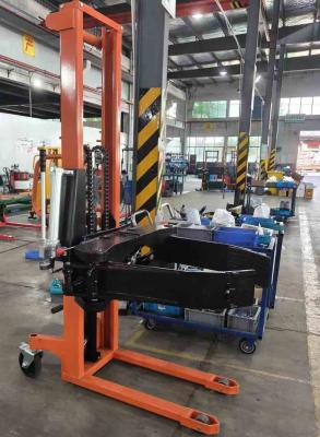 China CE Certificated 250kg 300kg 500kg 1.6meters Manual Roll Stacker With Clamp And Rotator for sale