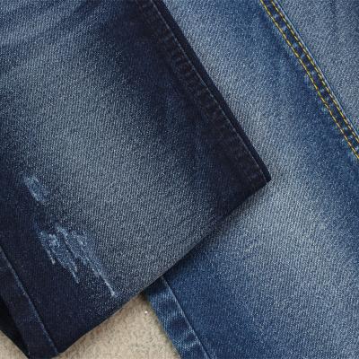China denim fabric  with stretch suitable for women jeans making at 9.9 OZ in dark  blue color for sale