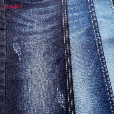 China Women Jeans Fresh Stretch Denim Fabric With Clear Warp Slub Dark Blue Color for sale