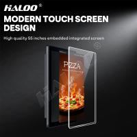 China 55-inch touchscreen pizza vending machine with heating and baking system, featuring an LED lightbox on the top of the pizza machine for sale