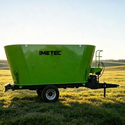 China IMETEC Vertical Auger TMR Mixer with Stainless Steel Construction and Hydraulic Unloading Door for Dairy & Beef Farms for sale