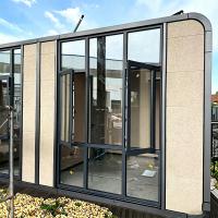 China Steel Frame Apple Container House With Wood Grain Paneling and Full Height Glass for Office or Retail Space for sale