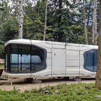 China Modern Design Portable Restaurant Prefabricated Steel Container House with Panoramic Space Capsule Vessel House for sale