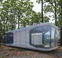 China Guangdong Foshan Prefabricated Commercial Luxury Modular Tiny Home apple Cabin 2 Bedroom Space Capsule House with Kitchen for sale