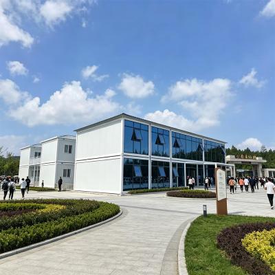 China Steel Frame Flat Pack Container Home With Glass Curtain Wall for Remote Area Housing or Commercial Use for sale