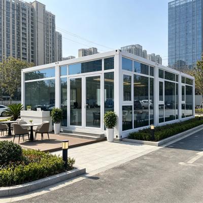 China Modern Glass Wall Packing Box House With Outdoor Seating Area for Urban Cafe Shop and Commercial Pop up Store for sale