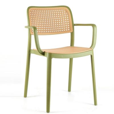 China Modern Stackable Plastic Dining Chair Rattan Design Armrest for sale