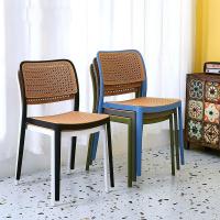 China Modern Stackable Plastic Dining Chair Rattan Design Armrest for sale
