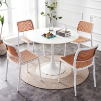 China Modern Stackable Plastic Dining Chair Rattan Design Armrest for sale