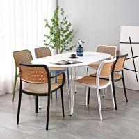 China Modern Stackable Plastic Dining Chair Rattan Design Armrest for sale