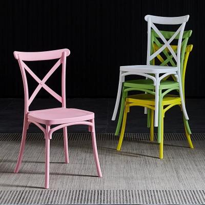 China Modern PP Plastic Dining Chair X Cross Back Stackable Custom Colors for sale
