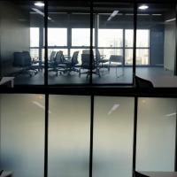 China Switchable Electric Smart Glass PDLC Film 0.5mm Thickness 1800x50000mm Size Remote Control Opaque Transparent for sale