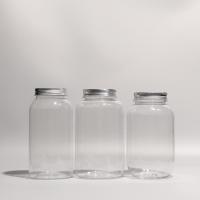 China Custom Capacity Empty PET Bottle Plastic Juice Bottle With Screw On Lid for sale