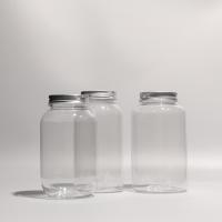 China Custom Capacity Empty PET Bottle Plastic Juice Bottle With Screw On Lid for sale