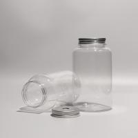 China Customized Logo Round Clear Empty PET Bottle With Screw On Aluminum Lid for sale