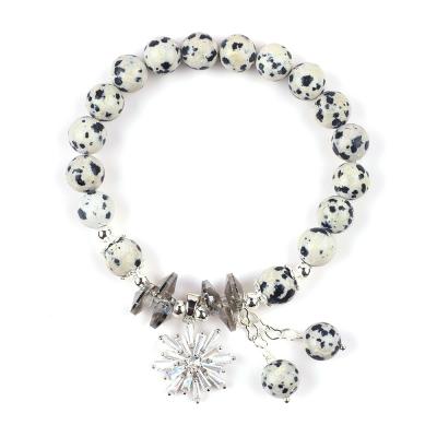 China Custom 8mm Round Dalmatian Jasper Bead Bracelet with Snowflake Charm Copper Silver Plating for sale