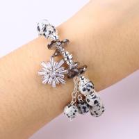China Custom 8mm Round Dalmatian Jasper Bead Bracelet with Snowflake Charm Copper Silver Plating for sale