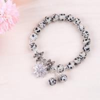 China Custom 8mm Round Dalmatian Jasper Bead Bracelet with Snowflake Charm Copper Silver Plating for sale
