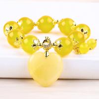 China 14mm Natural Yellow Chalcedony Yellow Jade Heart Carving Lucky Crystal Bead Bracelet Unisex for sale