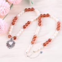 China Natural Strawberry Quartz 5mm Freshwater Pearl Necklace with Heart Charm - Unisex Sweater Design for sale