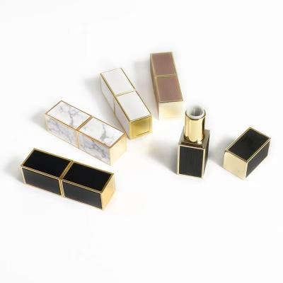 China Custom Lipstick Packaging Tubes with Squeeze Mechanism and Display Stand - Wholesale Cosmetic Containers for sale