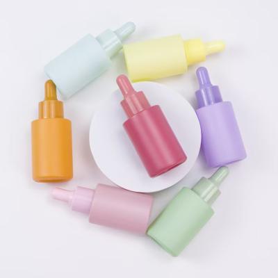 China 30ml Macaron Color Essential Oil Bottle with Plastic PP Pump and UV-Protective Glass for sale