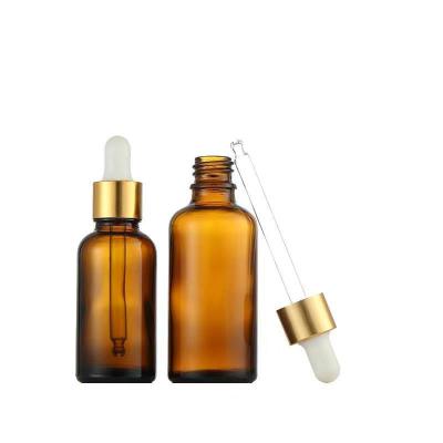 China 30ml 50ml 100ml Amber Glass Essential Oil Bottles with Euro Dropper and Tamper Evident Cap for sale