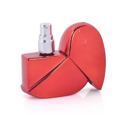 China 25ml Heart Shaped Glass Perfume Spray Bottle with Anodized Aluminum Pump for sale