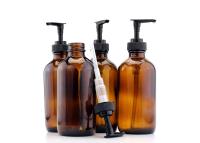 China 300ml Amber Glass Bottle with 28/400 Black Plastic Lotion Dispenser - Food Safe UV Protection Packaging for sale