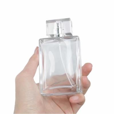 China 100ml Transparent Square Glass Perfume Bottle with Pump Sprayer Custom Logo for sale