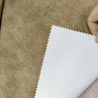 China Factory's New Retro Two Tone Cowhide Fluff PU Leather 2 Ways Stretch Brushed Backing Leather Pu Leather for Garments for sale