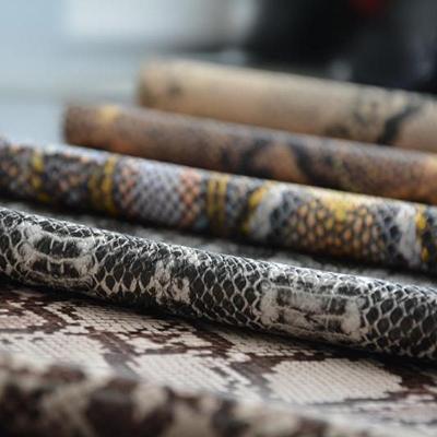China High Gloss Embossed Faux Snake Skin Leather PU Synthetic Leather for Hand Bags Hair Bows Footwear for sale
