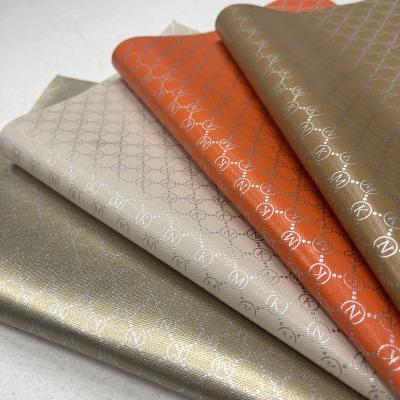 China Hot Sale Stock Pu  Leather Very Cheap Price 0.6mm Nappa Pattern Bag Leather for sale
