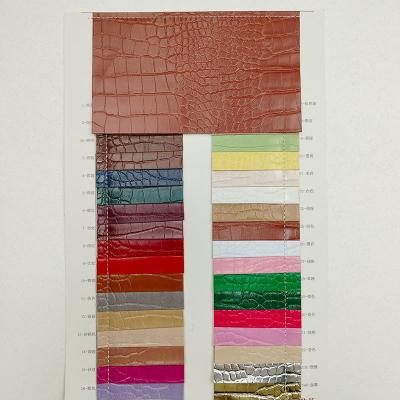 China Factory Stock Crocodile Pattern PU PVC Faux Artificial Synthetic Leather Fabric with Polyester Backing for Garments and Bag for sale