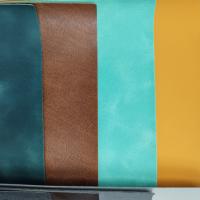 China Stocklot Bio-based PU Designer Leather Fabric Thermal Leather Fabric for Making Notebook and Trademark for sale