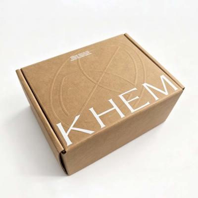 China Custom Kraft Corrugated Mailer Boxes with White Foil Stamping Embossed Logo for sale