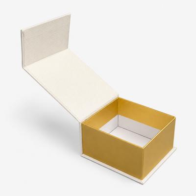 China Custom Beige Magnetic Perfume Box with Embossed Pattern Gold Foil Logo for sale