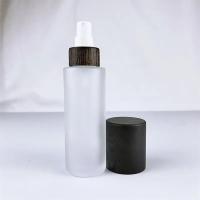 China Glass Shampoo Cosmetic spray Pump Bottle With Bamboo Cap for sale