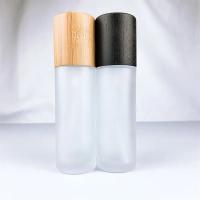 China Glass Shampoo Cosmetic spray Pump Bottle With Bamboo Cap for sale