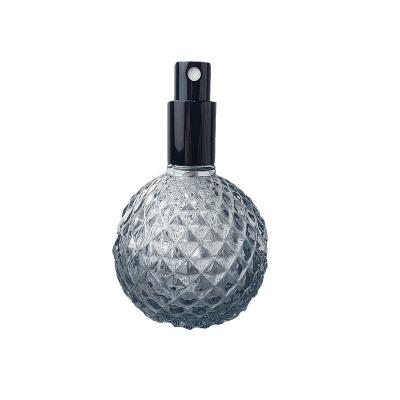 China Empty 100ml Grain Pineapple Shape Custom Design Screw Neck Perfume Glass Bottles for sale