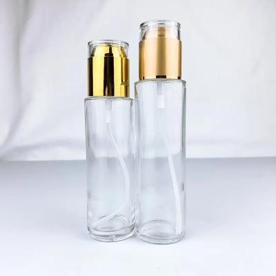 China round empty glass cosmetic liquid foundation serum lotion bottle with pump for sale