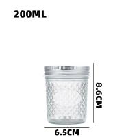 China Embossed Clear Glass Storage Jar with Screw Cap 30ml to 1000ml for Coffee Bean Peanut Oatmeal for sale