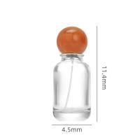 China Luxury Round Glass Perfume Bottle 50ml with Marble Lid and Mountain Bottom Design for sale
