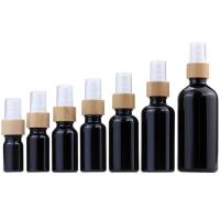 China 30ml Vintage Colored Glass Bottle with Bamboo Pump Sprayer 28/415 for Skin Care for sale