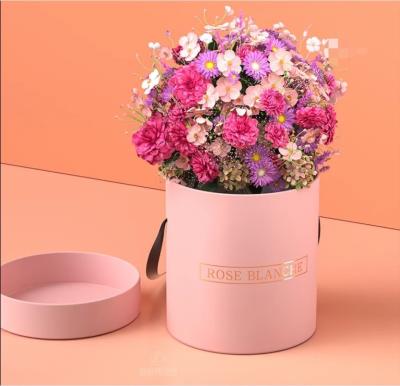 China Custom Luxury Round Flower Packaging Box with Ribbon Handle - 157gsm Paper & 1200gsm Cardboard Construction for sale