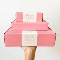 China Custom Logo Cardboard Shipping Mailer Box Pink Cosmetics Mailing Packaging with Raffias for sale