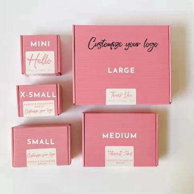 China Custom Logo Cardboard Shipping Mailer Box Pink Cosmetics Mailing Packaging with Raffias for sale